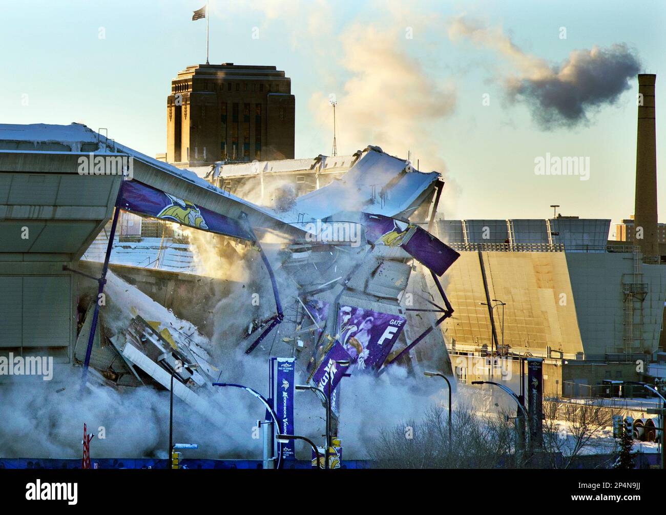 Parts of the Metrodome fall Sunday, Feb. 23, 2014, in Minneapolis ...