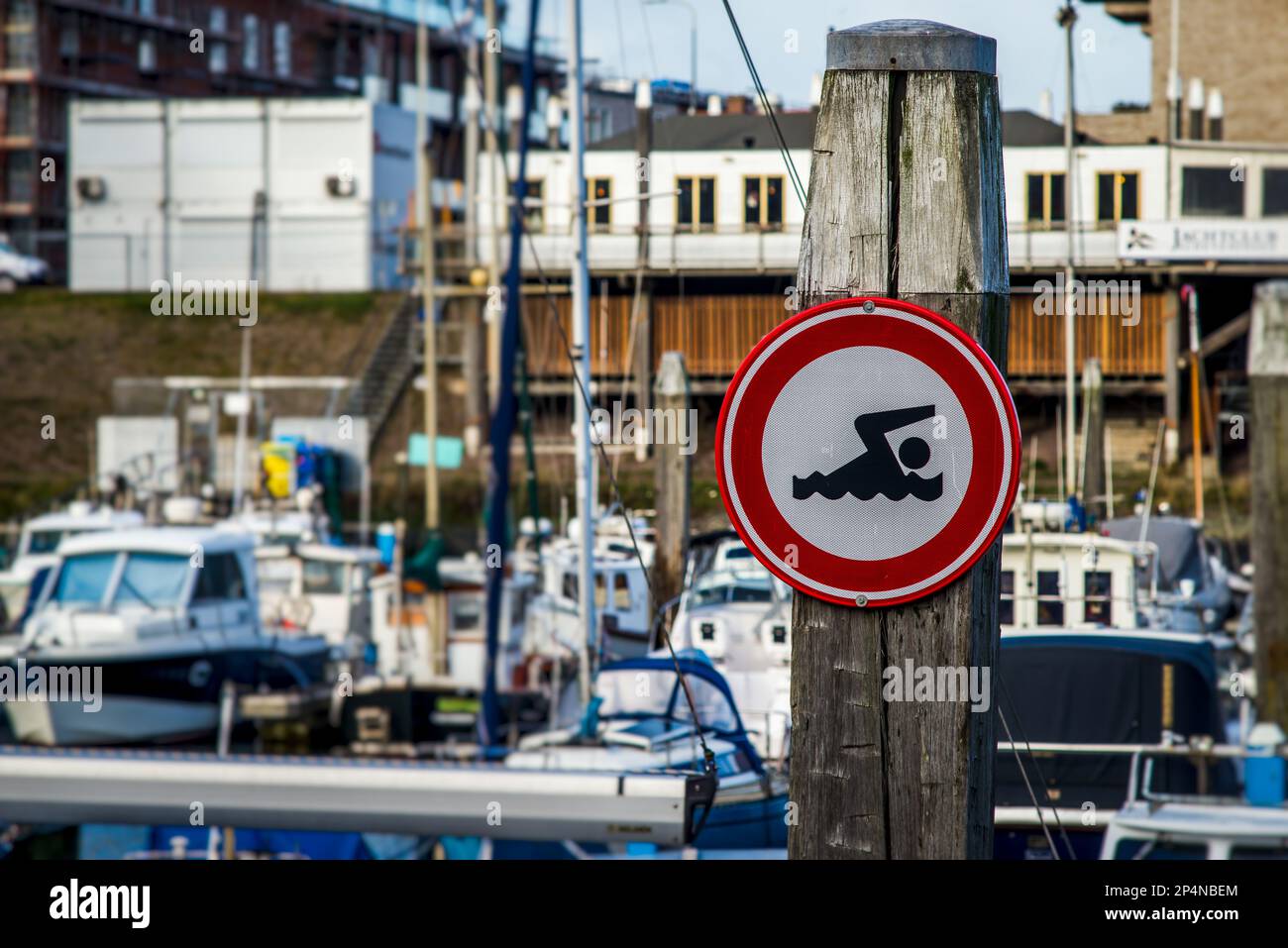 Forbidden swimming sign in Scheveningen marina Stock Photo - Alamy