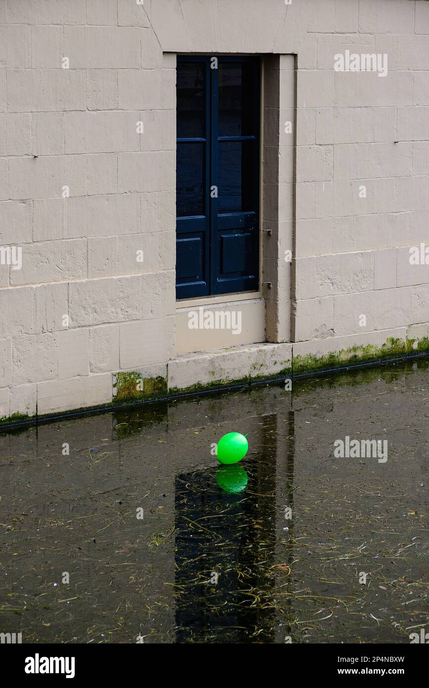 green balloon with reflection in the water Stock Photo - Alamy