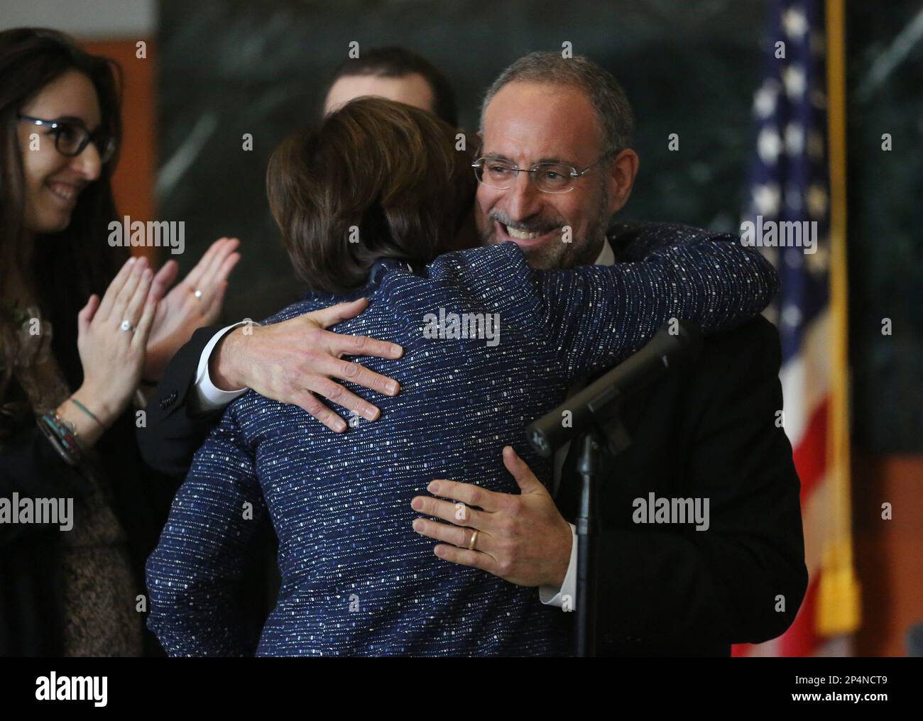 Andy Luger,got a hug from his wIfe, Ellen,after he was sworn in as U.S ...