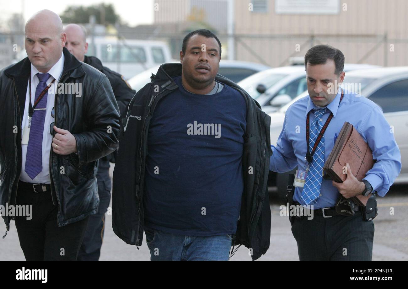 Authorities from the Harris County Sheriff's Office escort Matthew O ...