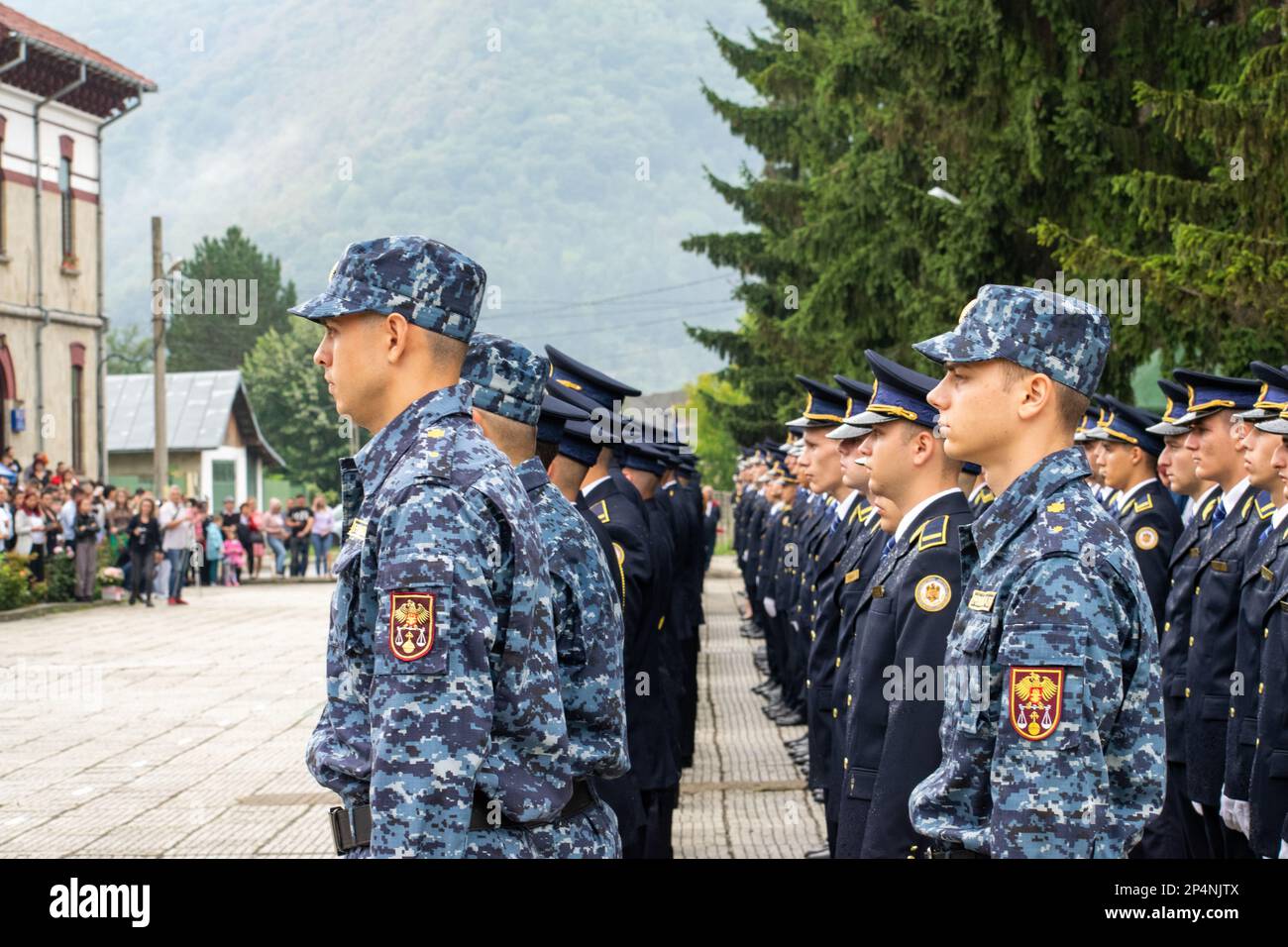 A group of police officers wearing new blue uniforms standing in ...