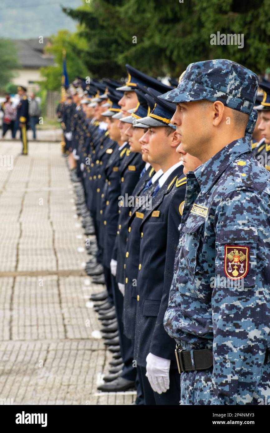 A group of men wearing military uniforms standing together in a ...