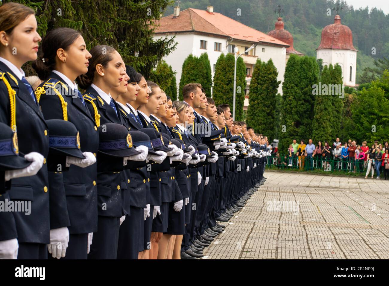 A group of female soldiers standing together in military uniforms and ...