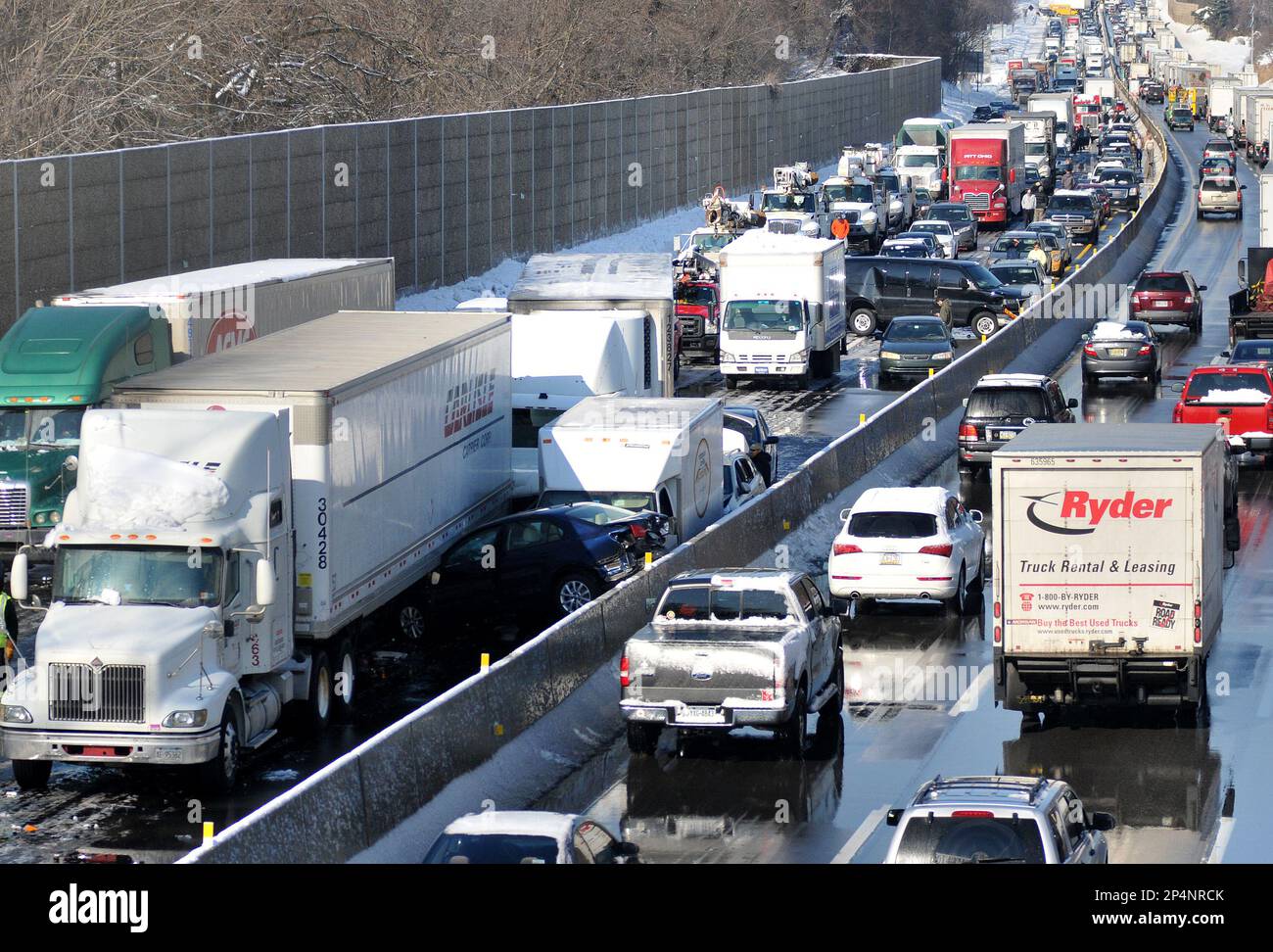 Vehicles are piled up in an accident, Friday, Feb. 14, 2014, in Bensalem, Pa. Traffic accidents ...