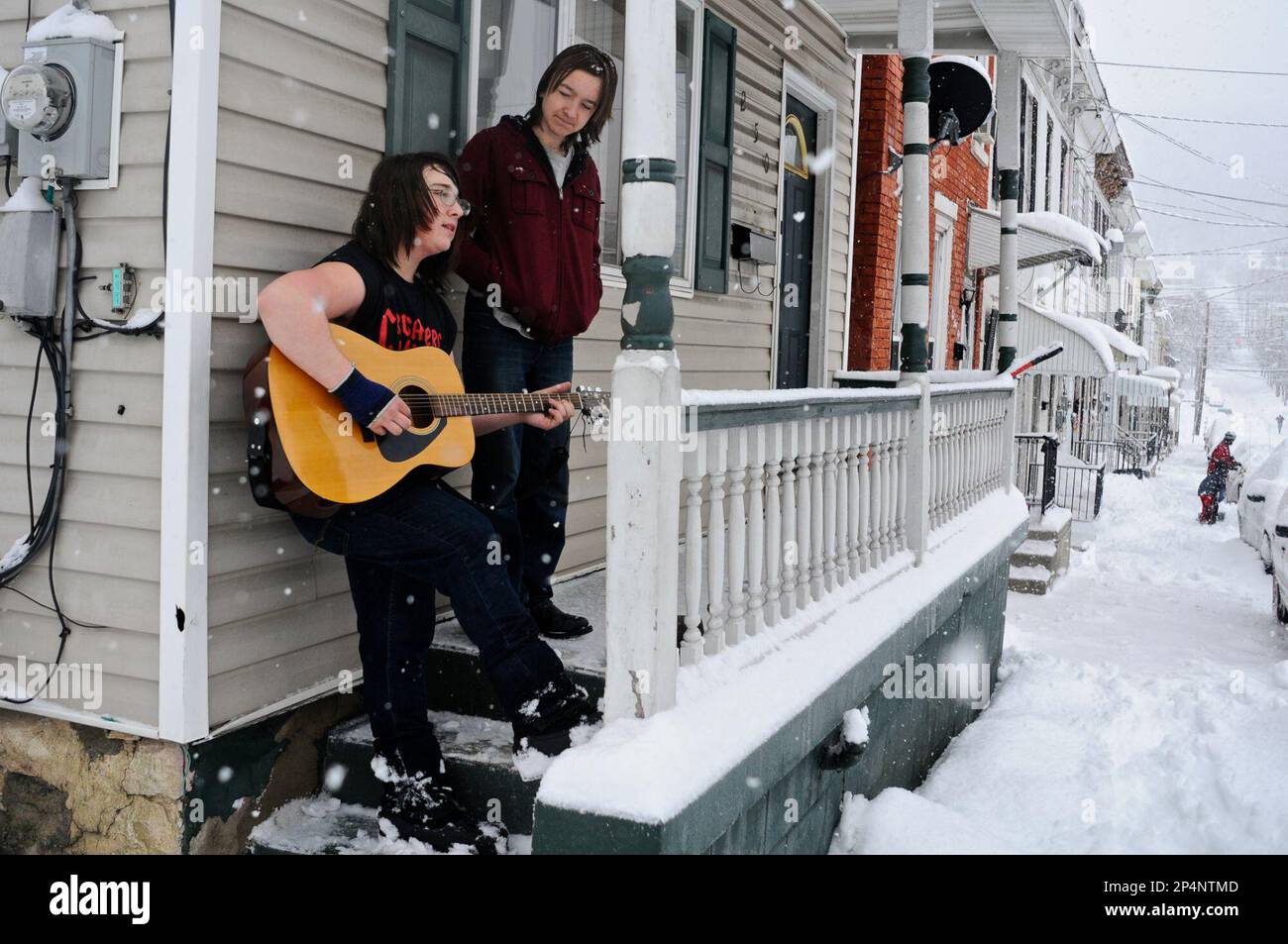 Chasing away the winter blues Charles Rubright, left, takes a break ...