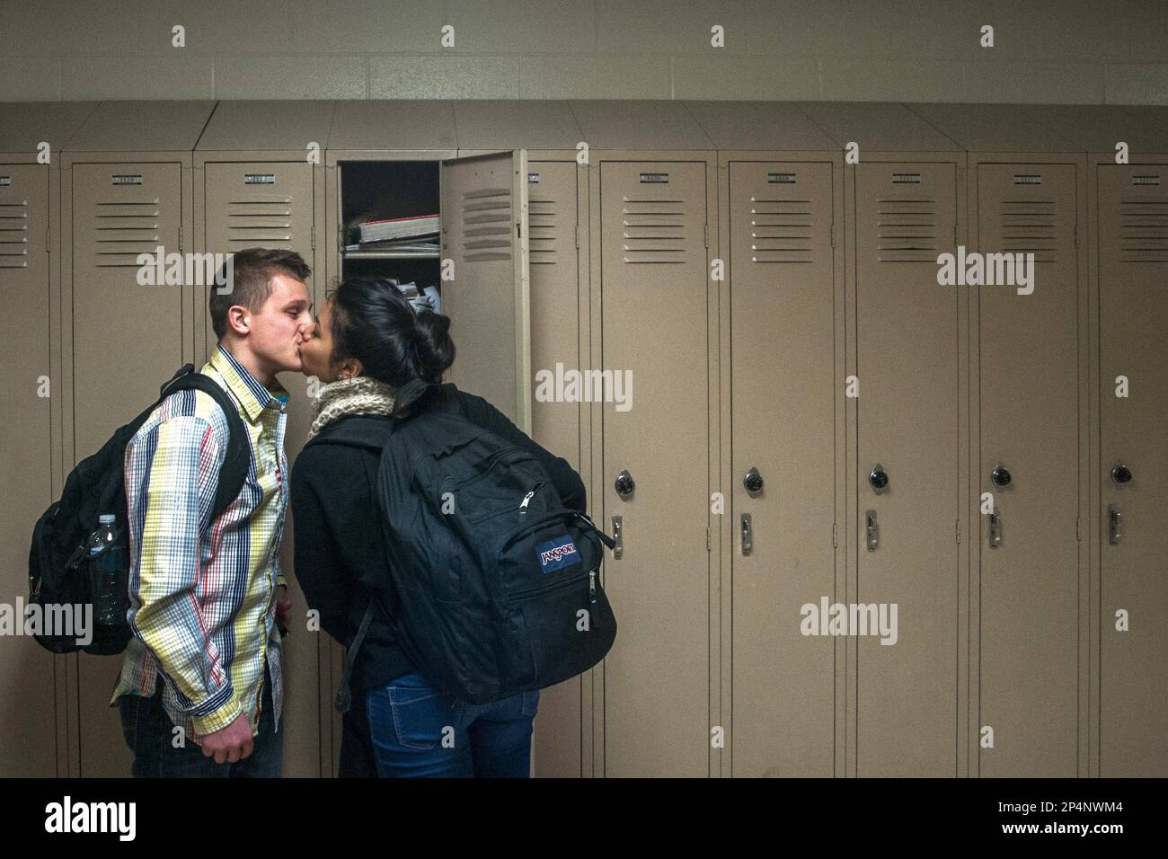 Grand Blanc's Mariah Koolthong, right, kisses her boyfriend Teddy ...