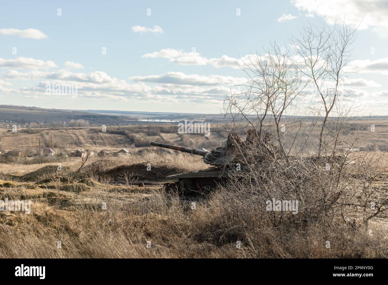 Wartime signs. Remains of destroyed military equipment on the outskirts ...
