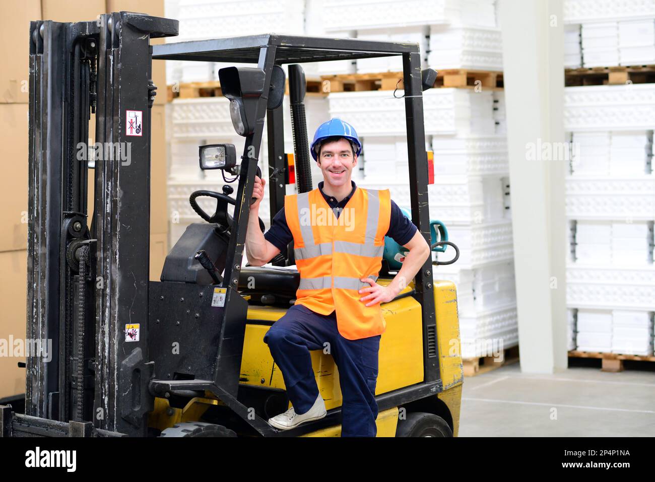 workers in a goods warehouse - storage and transport of goods by mail ...