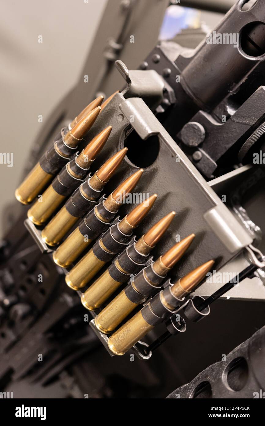 Close up of of bullets in a coaxial machine gun belt Stock Photo - Alamy