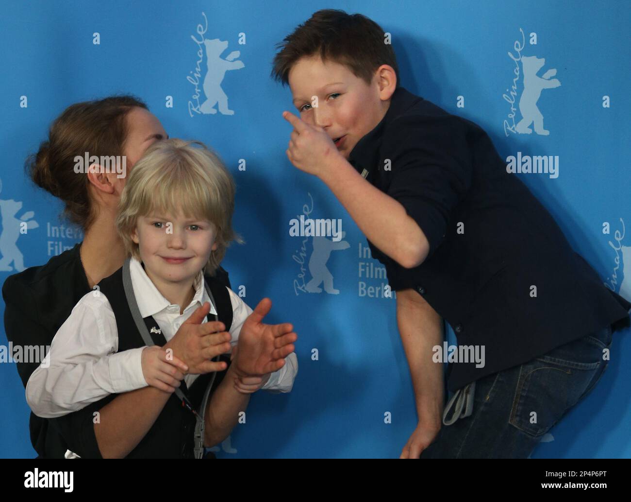 Actress Luise Heyer holds actor Georg Arms as actor Ivo Pietzcker ...