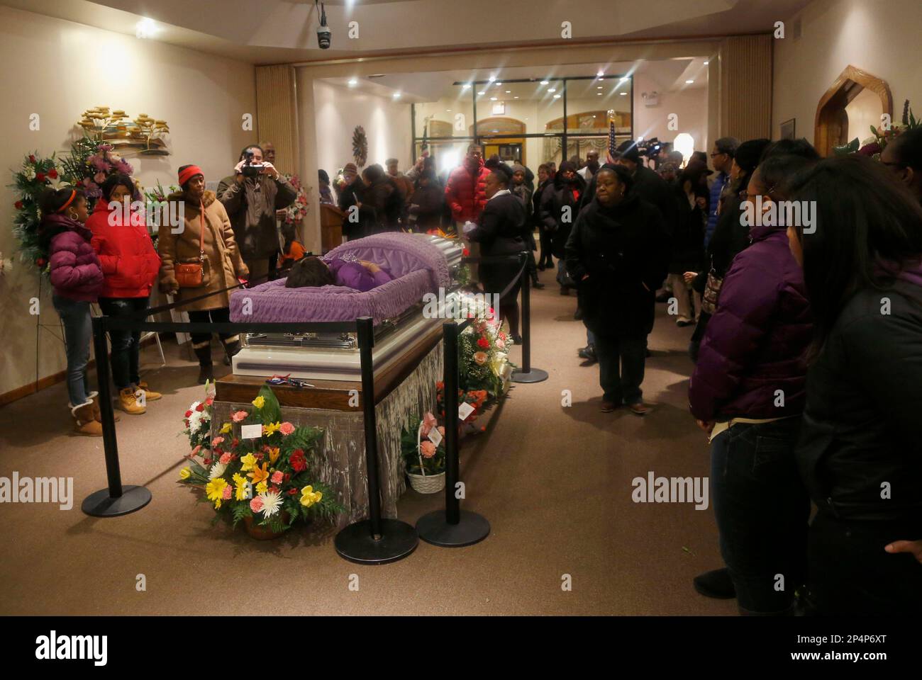 FILE - In this Feb. 8, 2013 file photo, mourners view the remains of 15 ...