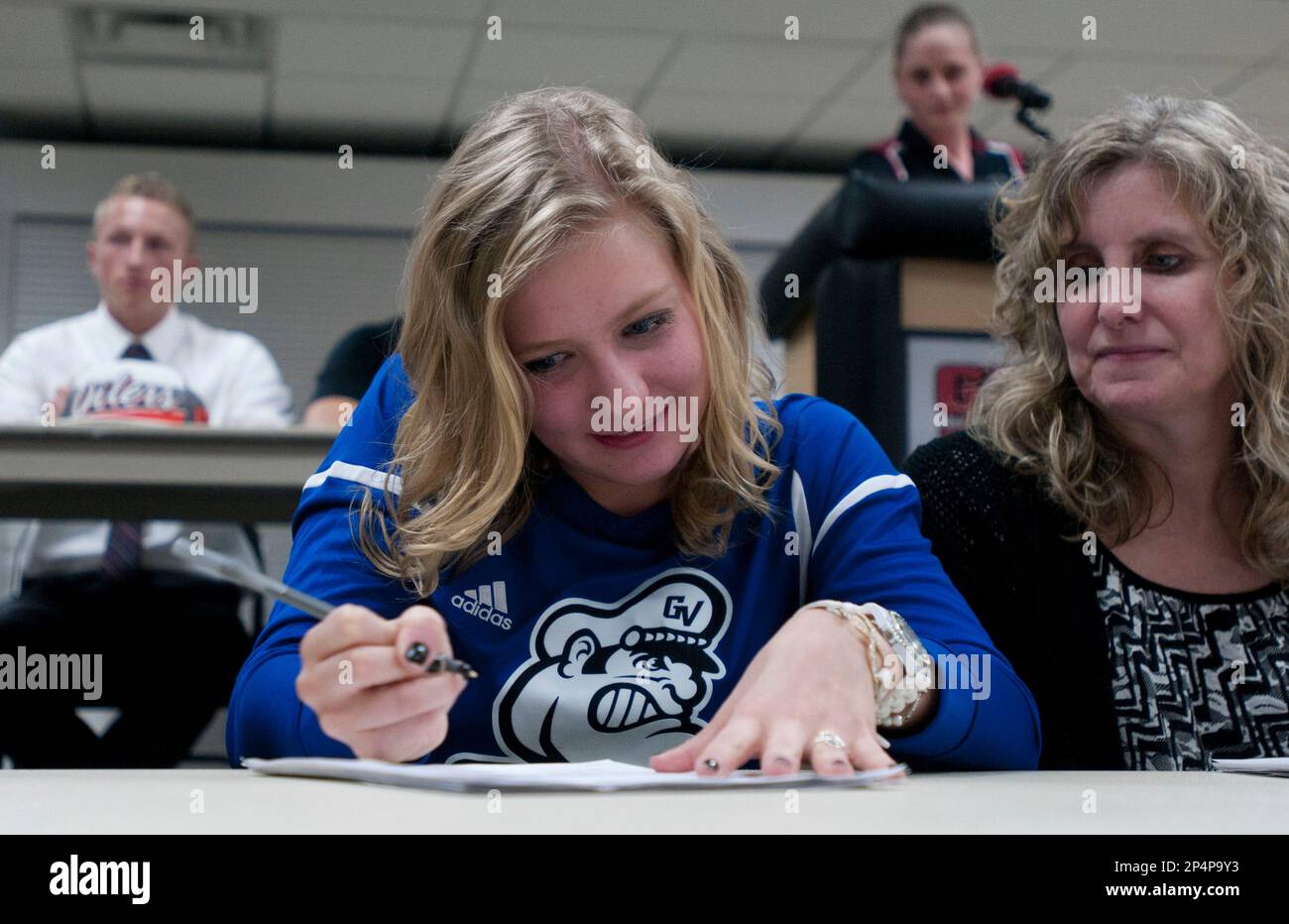 Grand Blanc swimmer Rachel Eaton excitedly signs the letter of intent ...