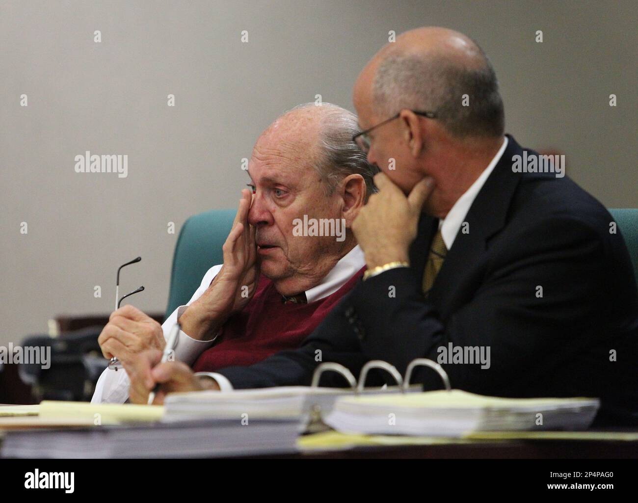 Retired Tampa Police captain Curtis Reeves, Jr., left, wipes his eyes ...