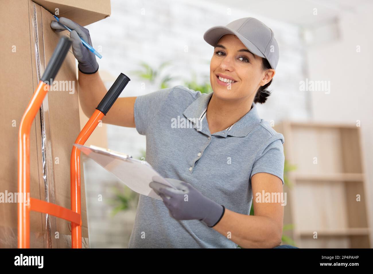 delivery woman happy at work Stock Photo - Alamy