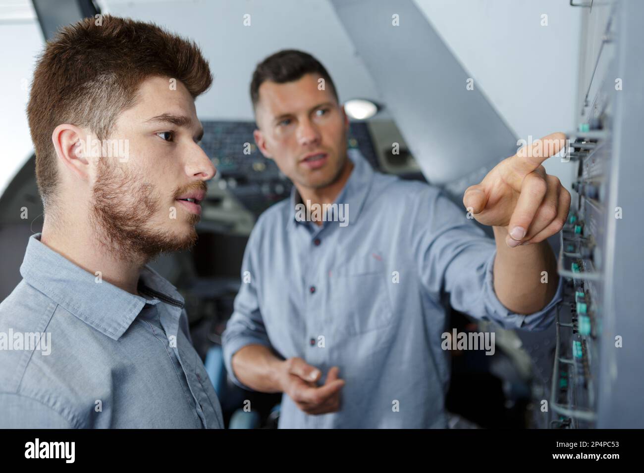 portrait of men and panel buttons Stock Photo - Alamy