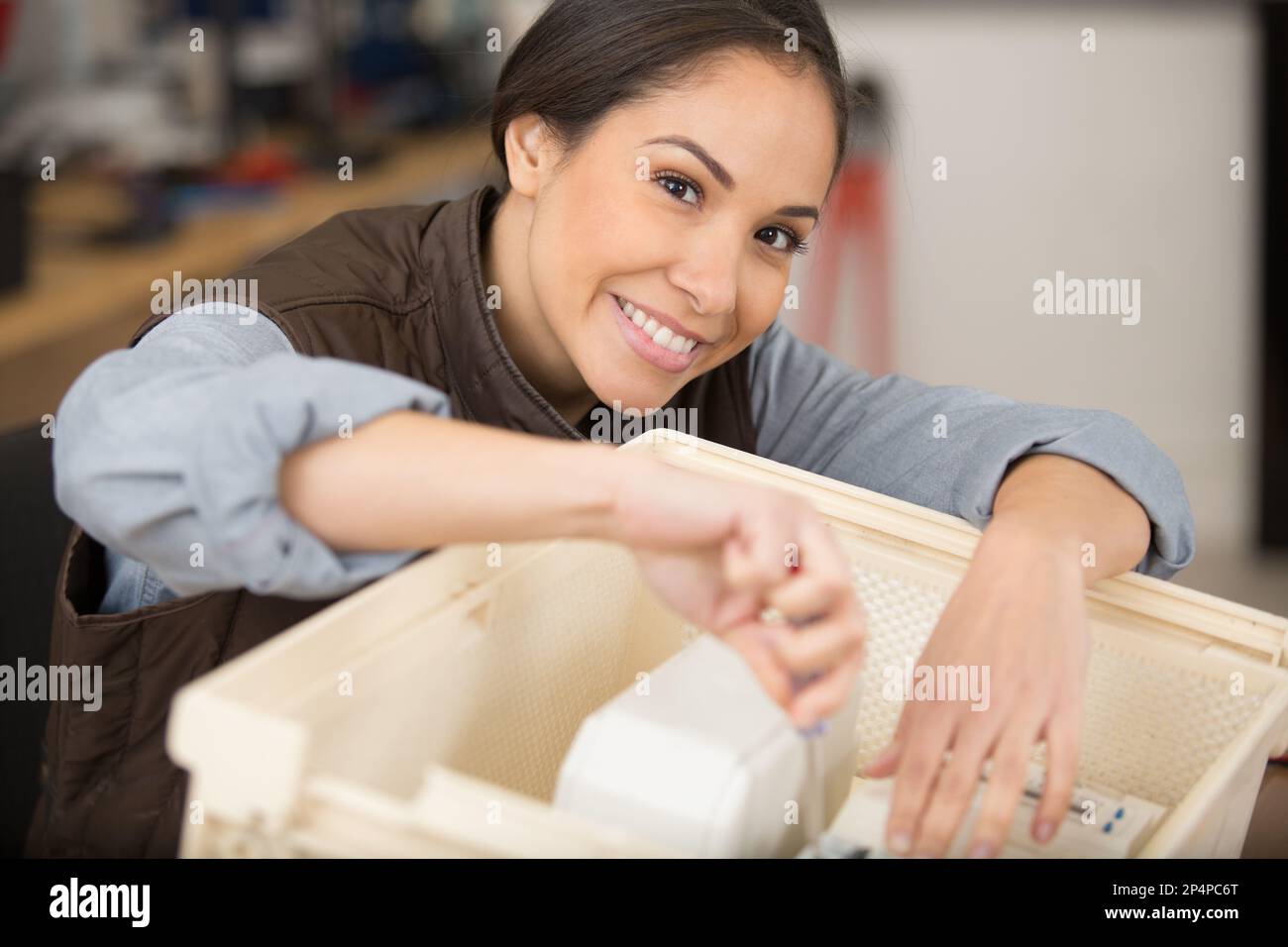 female electrician working on circuit breaker cabinet Stock Photo - Alamy