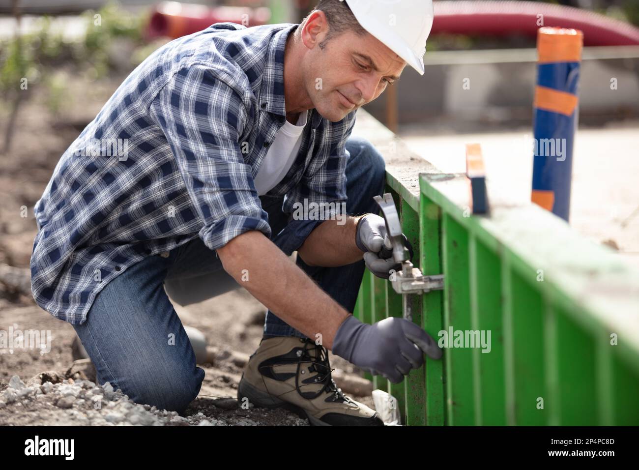 male construction worker clamping metal Stock Photo - Alamy