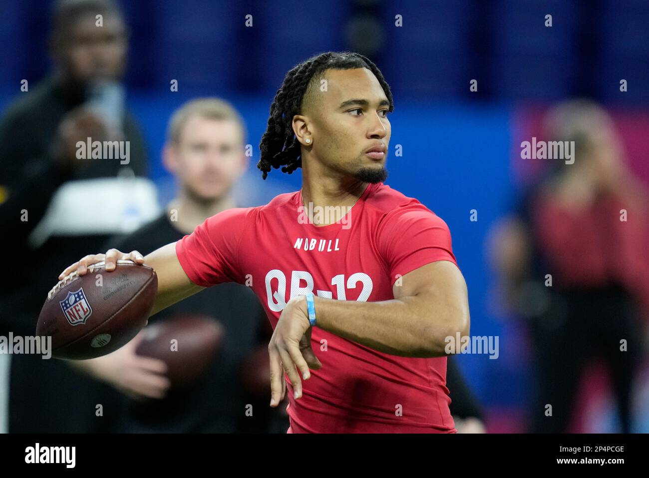 Ohio State quarterback CJ Stroud runs a drill at the NFL football scouting combine in ...