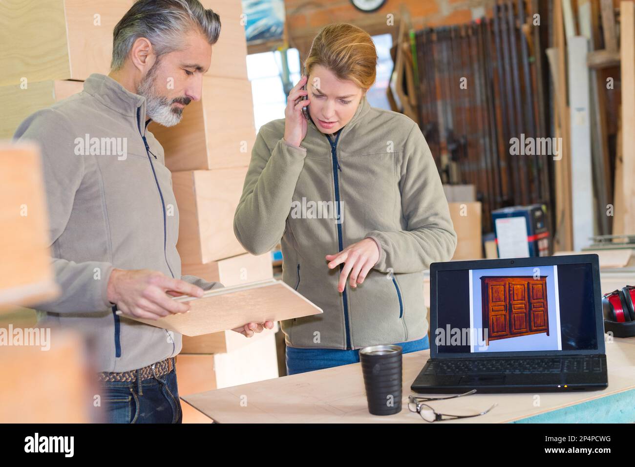 woman and man working together at workshop Stock Photo - Alamy