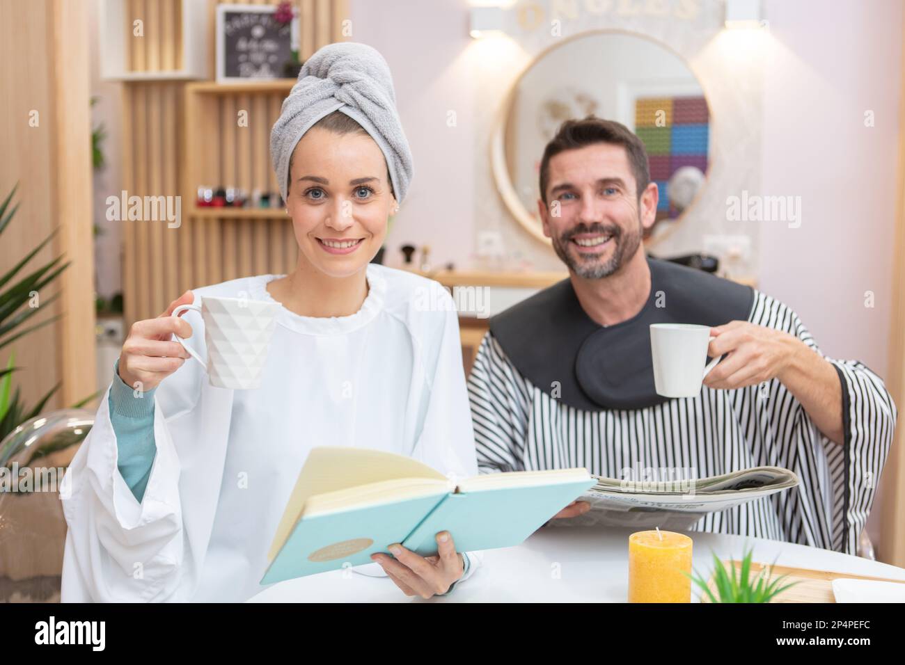 clients with magazines and coffees in a hairdressing salon Stock Photo ...
