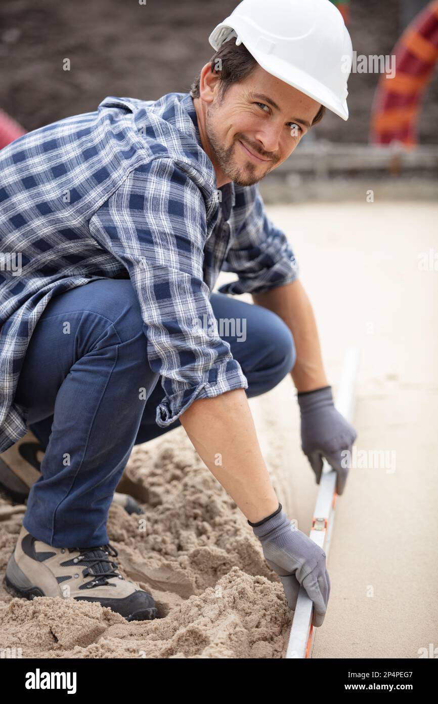 portrait of construction worker on building site Stock Photo - Alamy