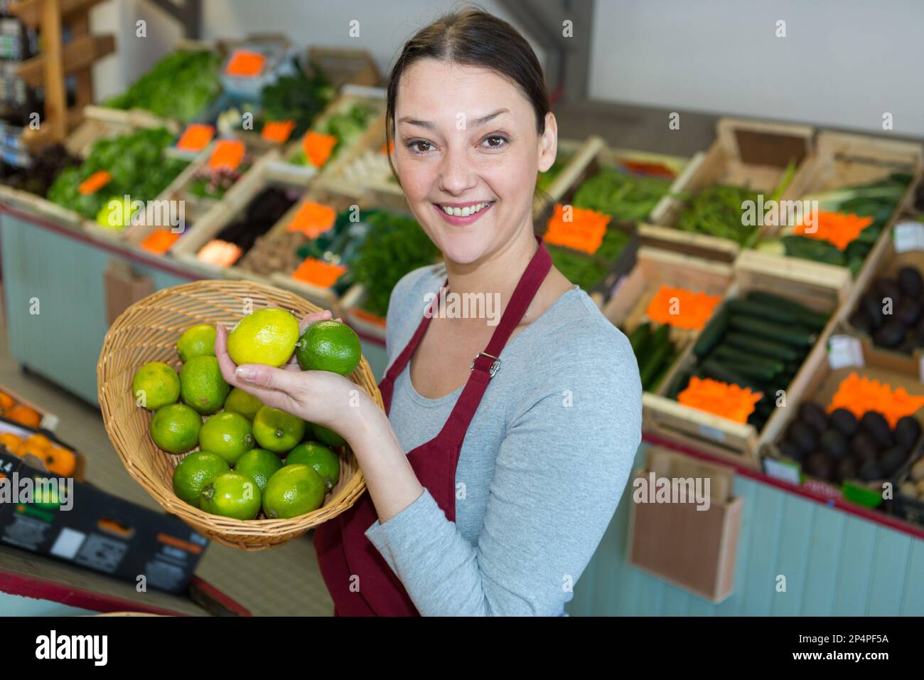 a happy smiling supermarket worker Stock Photo - Alamy