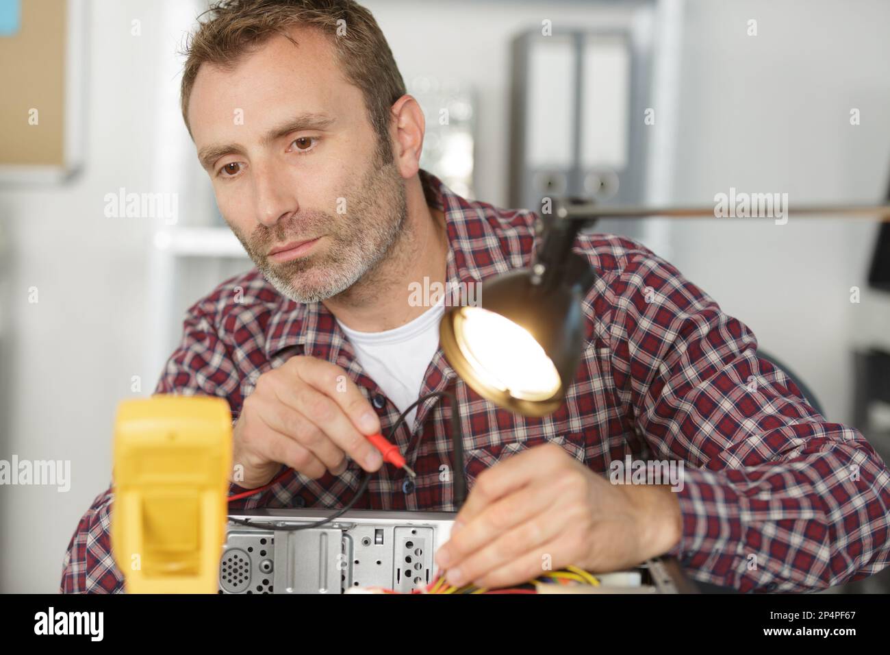 technician repairing a computer component Stock Photo - Alamy