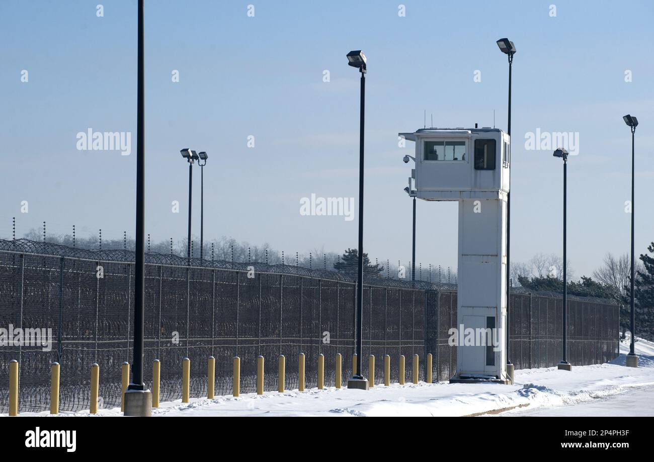 A guard tower stands over fencing at the Ionia Correctional Facility ...