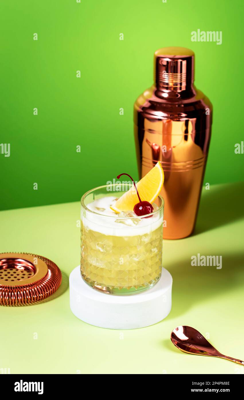 Whiskey sour cocktail with bourbon, lemon juice, egg white and ice ...