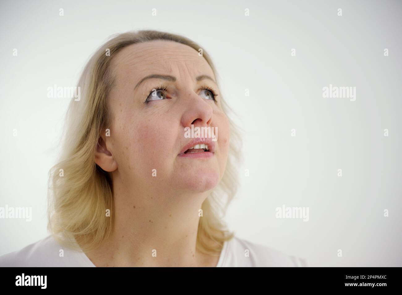 experiencing fear in the eyes of woman raised her eyes up moved her ...