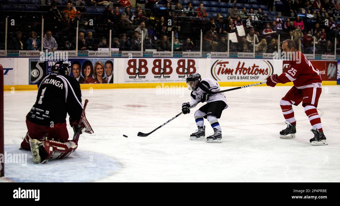 A player participating in the Shocks and Saves charity hockey game ...