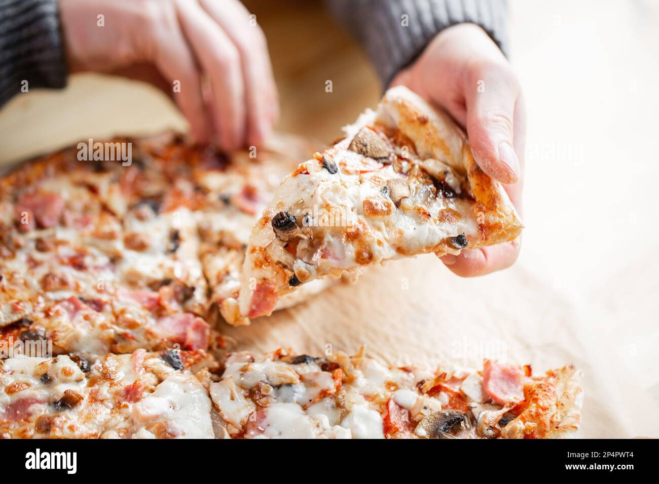 one people taking slices of pizza out of the box. fast delivery of food ...