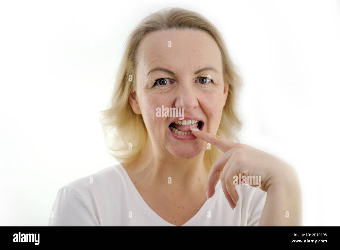 think over proposal woman bit index finger with teeth opened eyes and ...