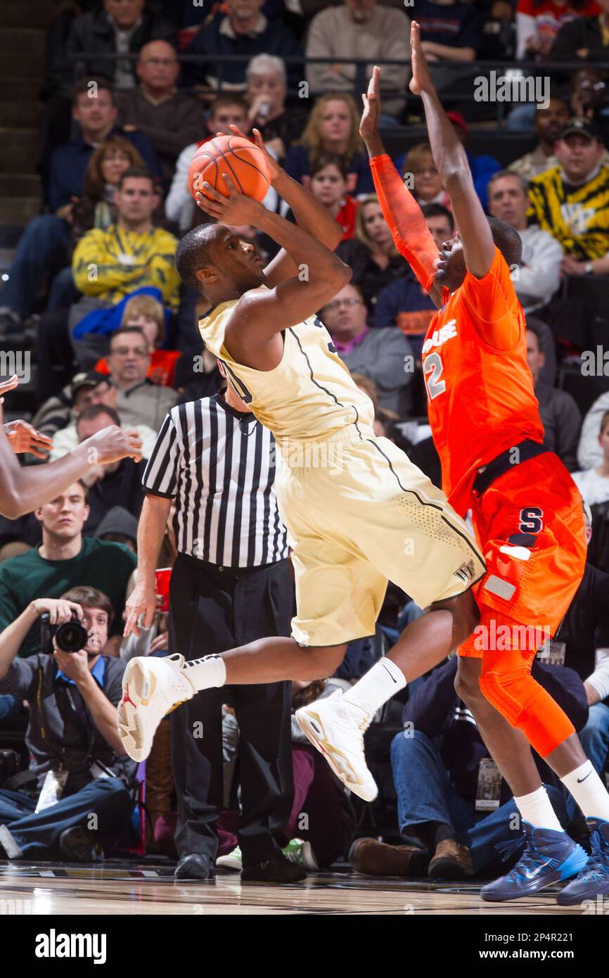 Travis McKie (30) of the Wake Forest Demon Deacons attempts to shoot ...