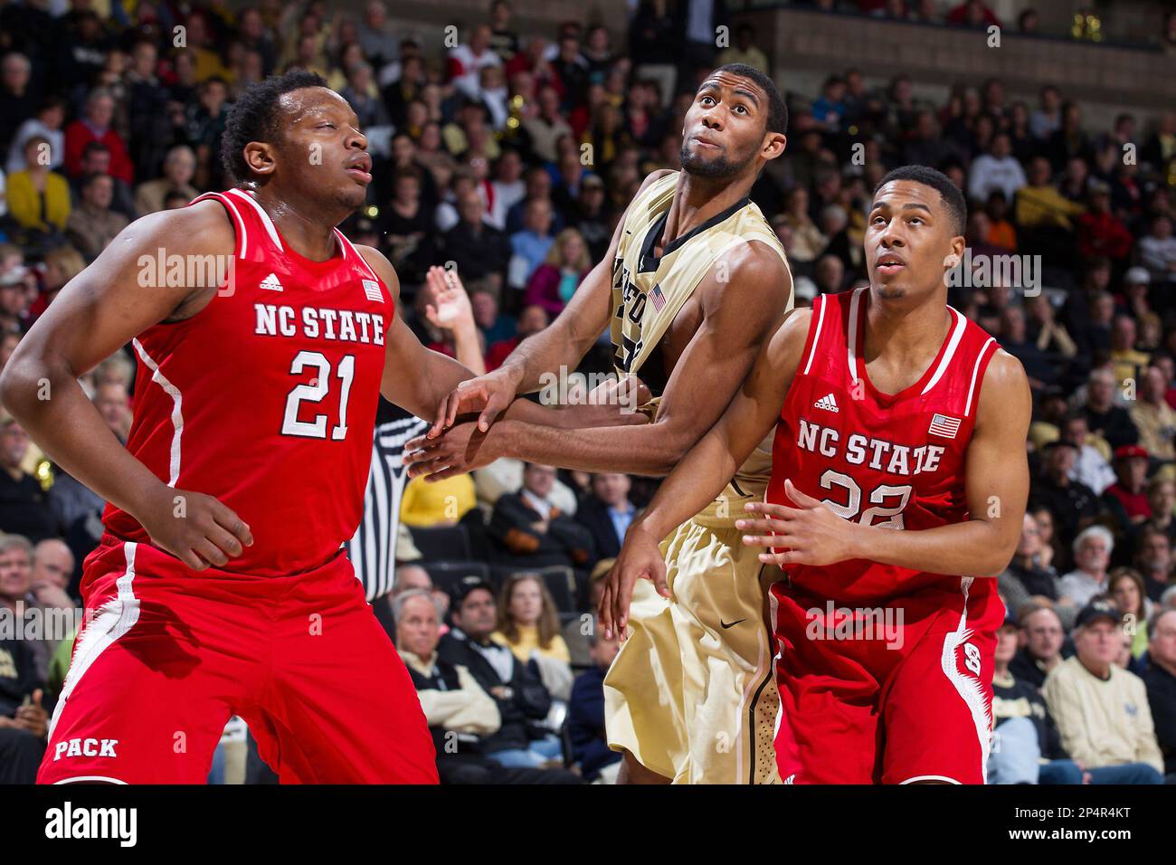 BeeJay Anya (21) and Ralston Turner (22) of the North Carolina State ...