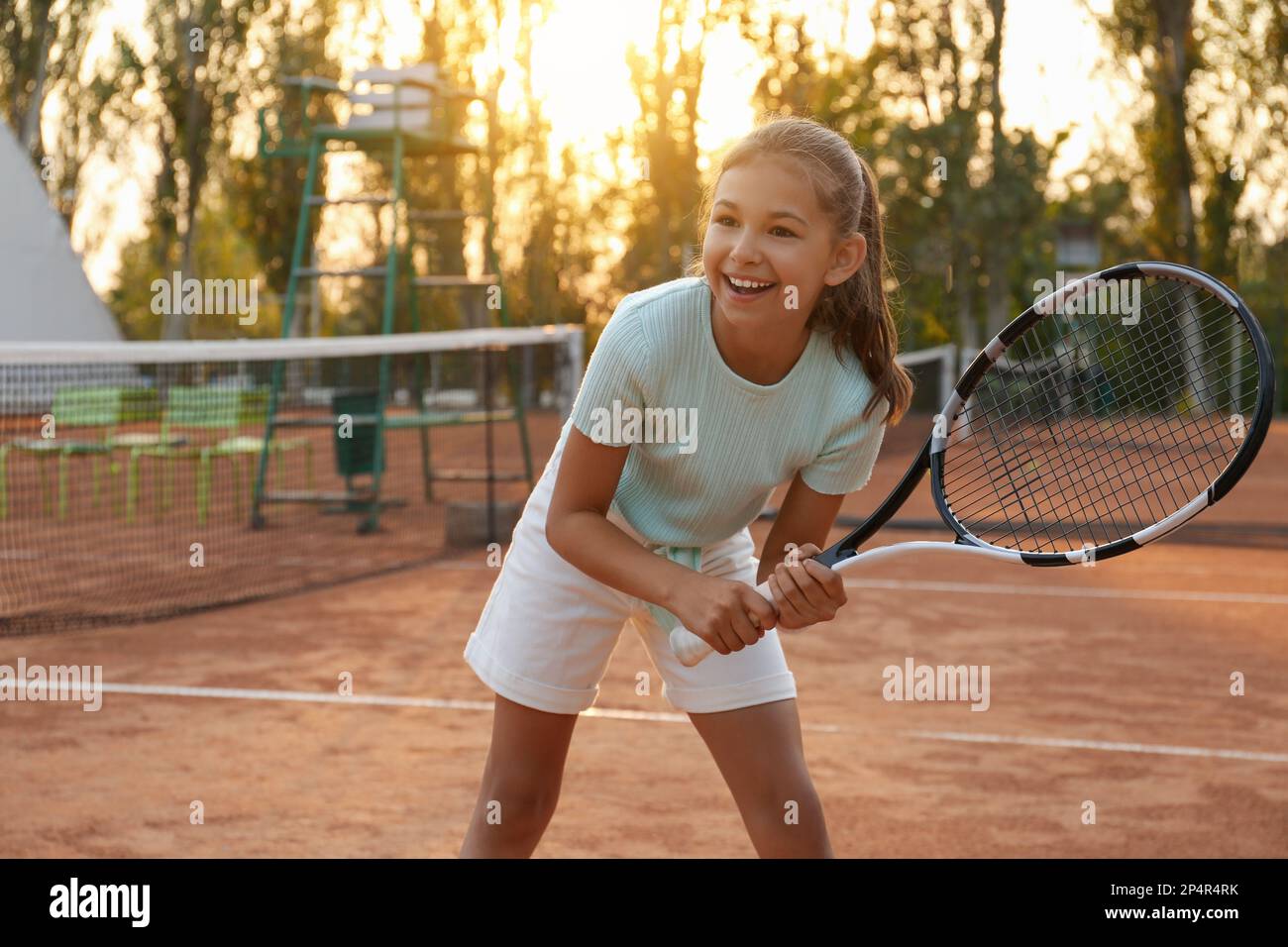 Cute Little Girl Playing Tennis On Court Outdoors Stock Photo Alamy Cute Little Girl Playing Tennis On Court Outdoors Stock Photo Alamy