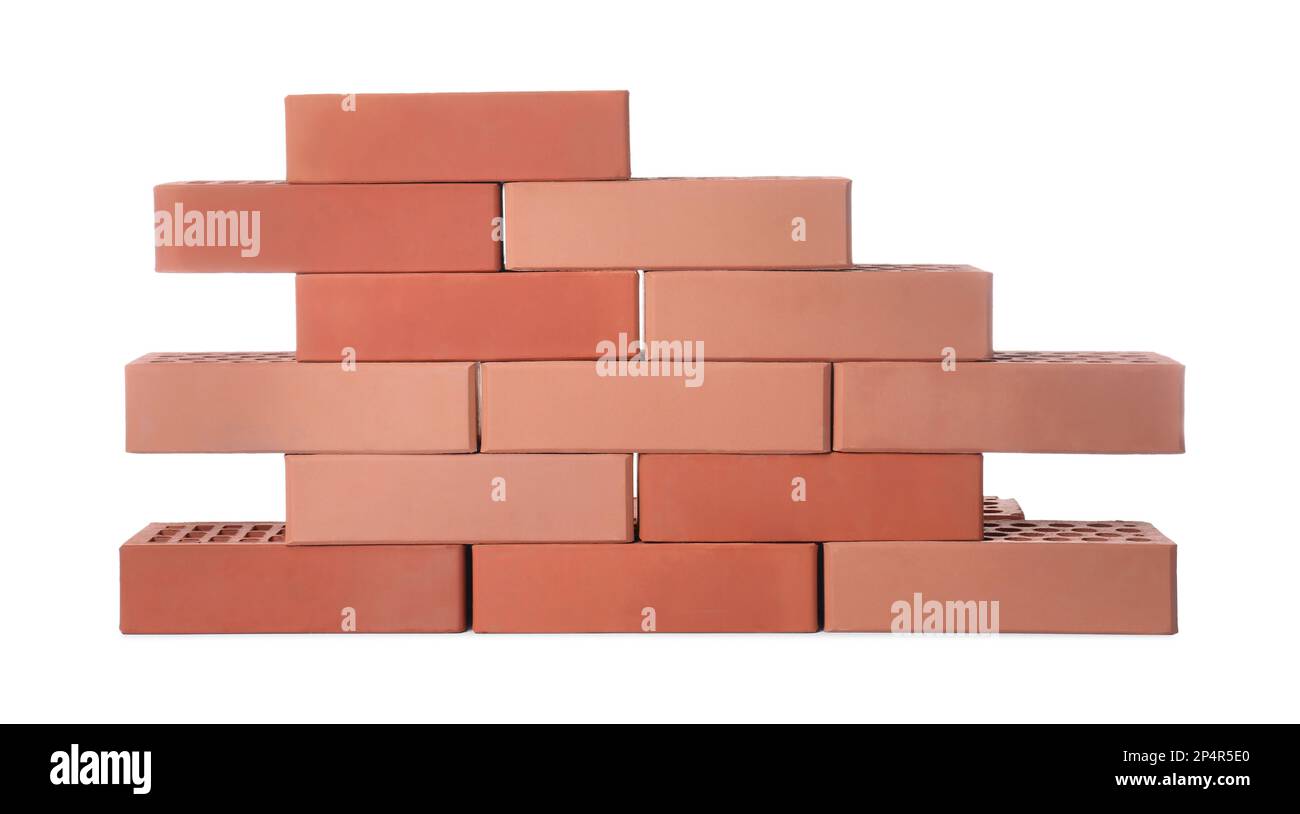Many red bricks on white background. Building material Stock Photo - Alamy