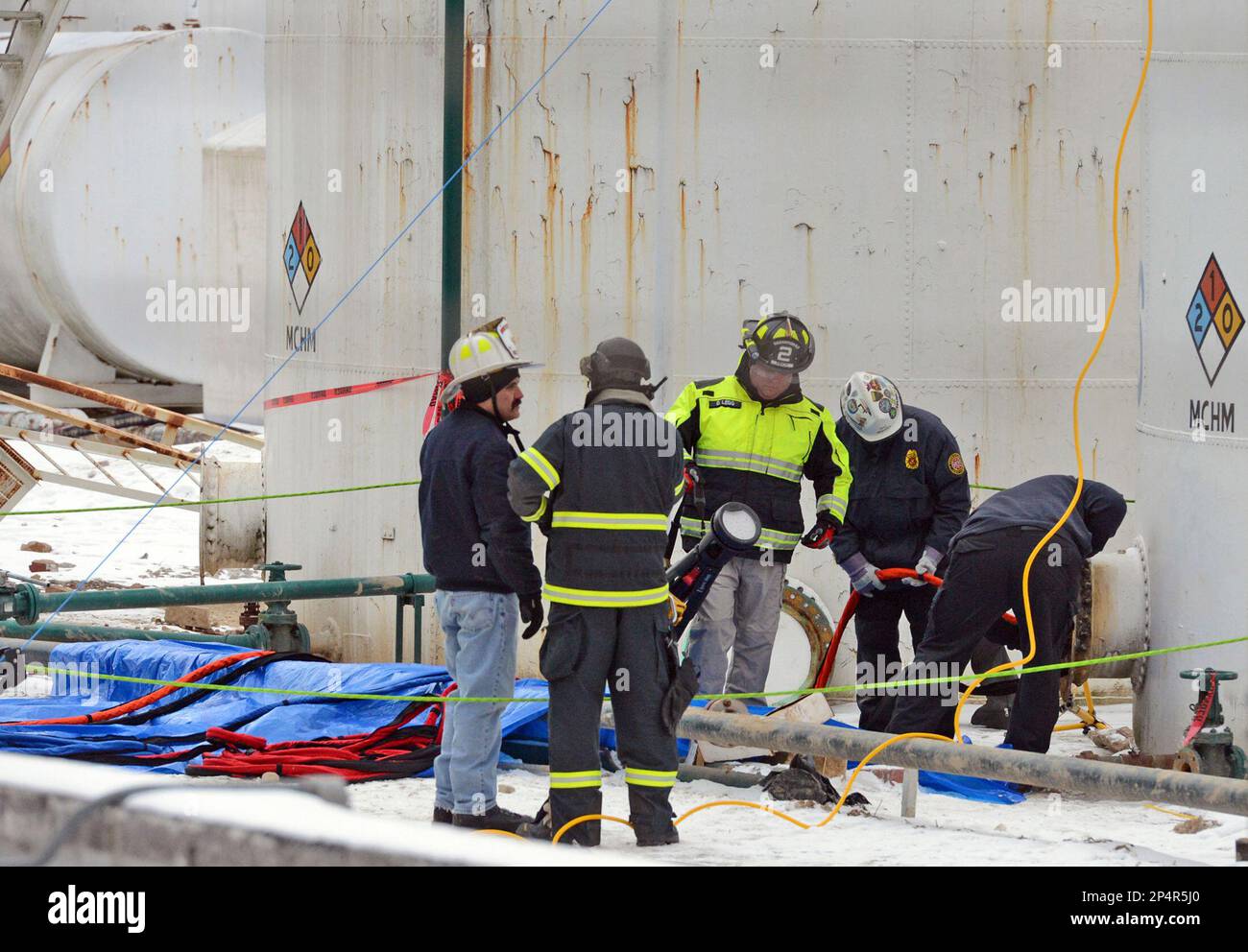 Members of the FBI Hazardous Materials Response Unit along with local ...