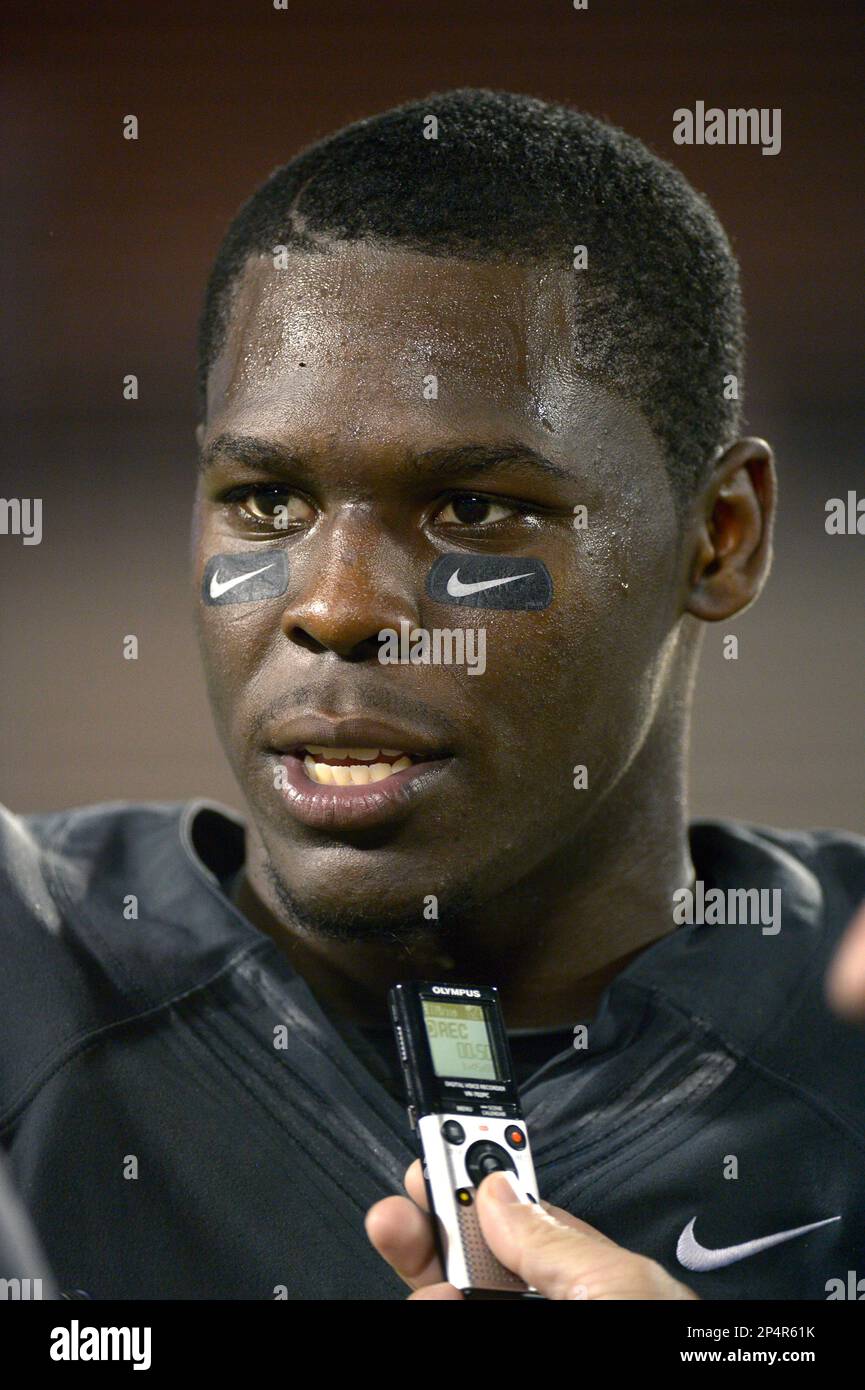 Booker T. Washington defensive end Chad Thomas talks to reporters after ...