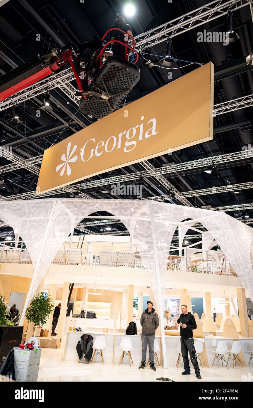 06 March 2023, Berlin: People work at the stand for Georgia before the ...