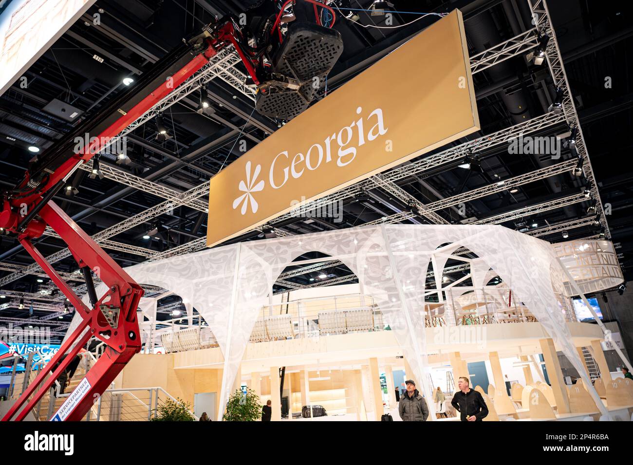 06 March 2023, Berlin: People work at the stand for Georgia before the ...