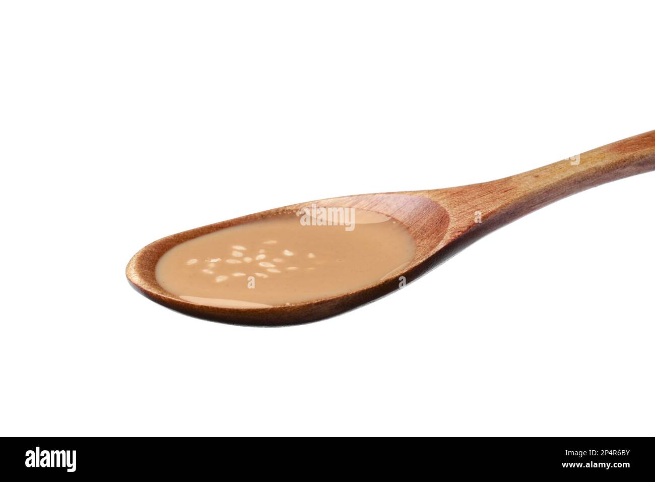 Spoon of tasty sesame paste isolated on white Stock Photo - Alamy
