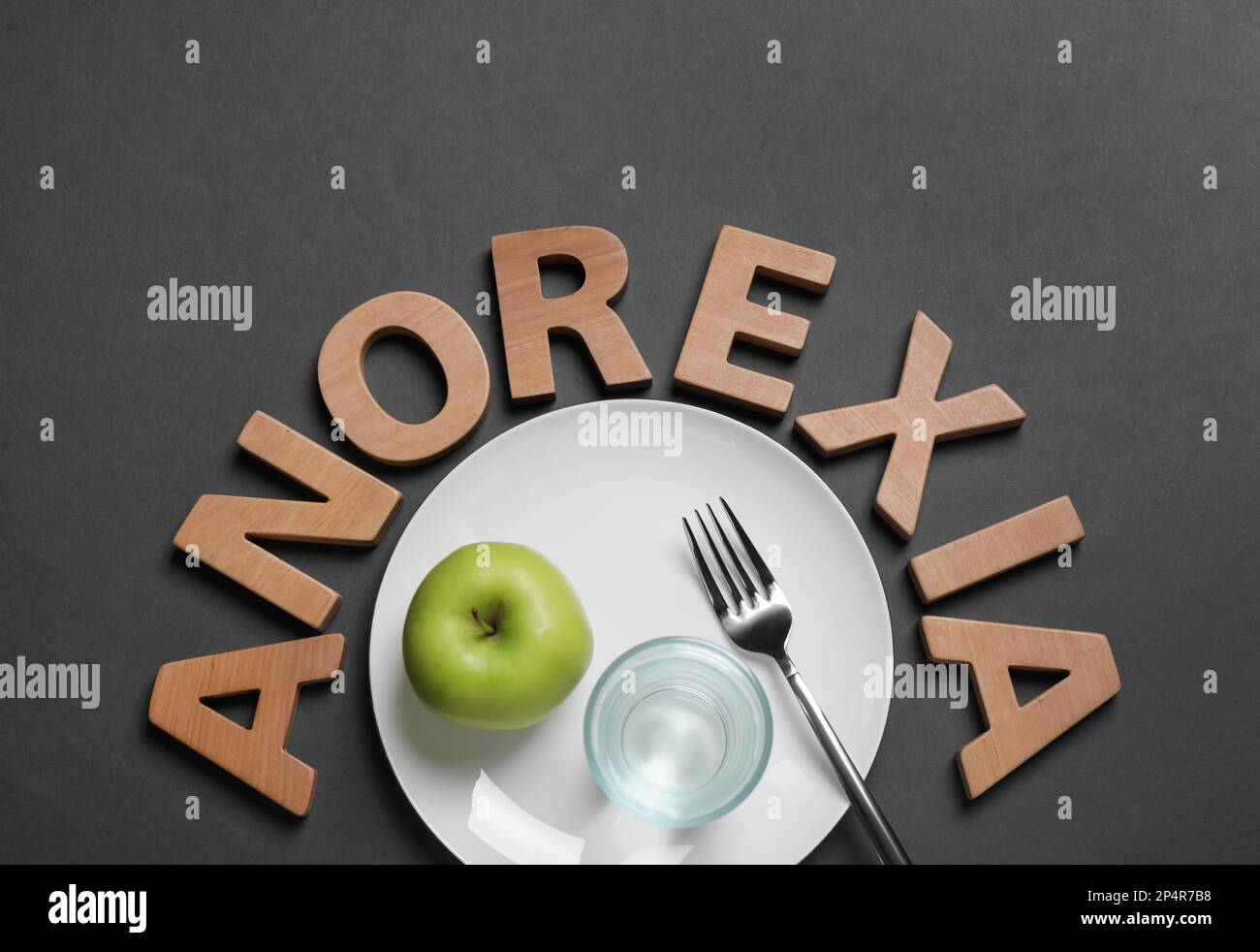 Flat lay composition with word Anorexia of wooden letters and table ...