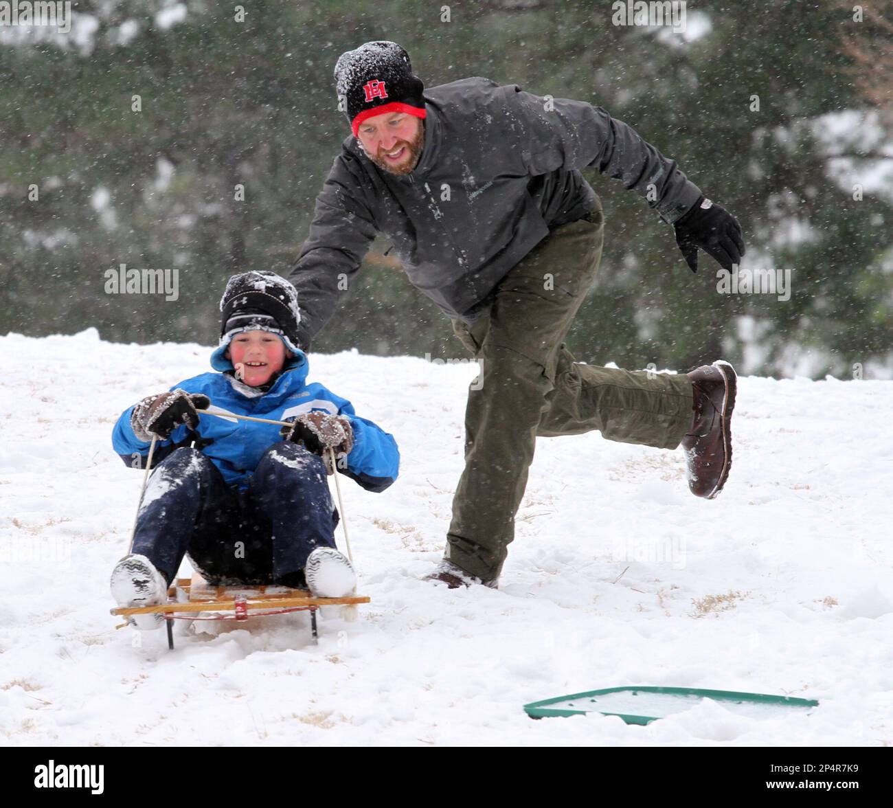 Judge Little, right, sends Wyatt Bond speeding down a hill in the snow ...