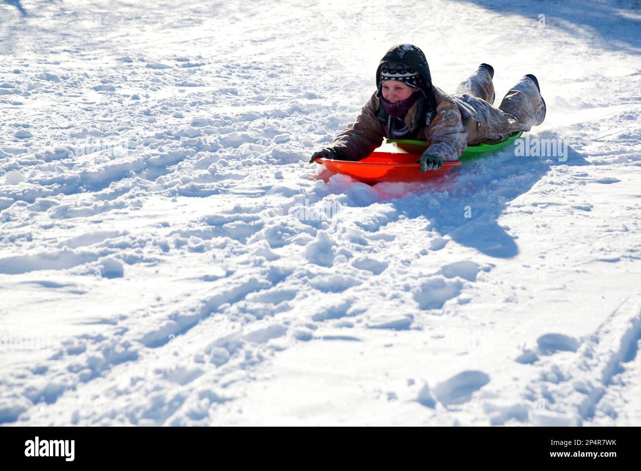 Rachel Peeples, of Nashville, Tenn., sleds down a hill on Tuesday, Jan ...