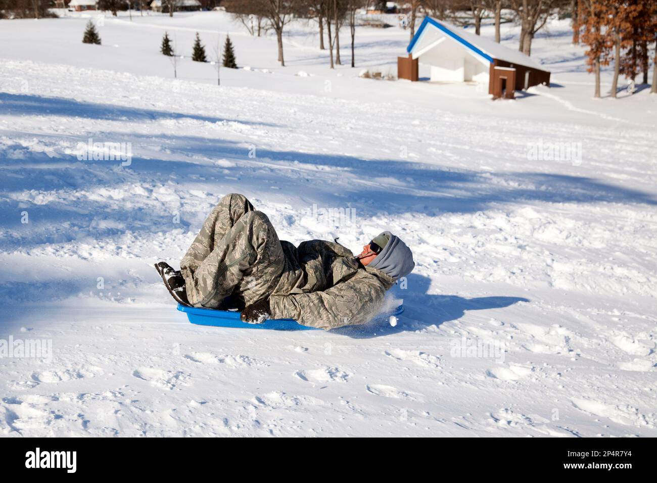 Daniel Peeples, of Nashville, Tenn., sleds down a hill on Tuesday, Jan. 28, 2014, at Cascades ...