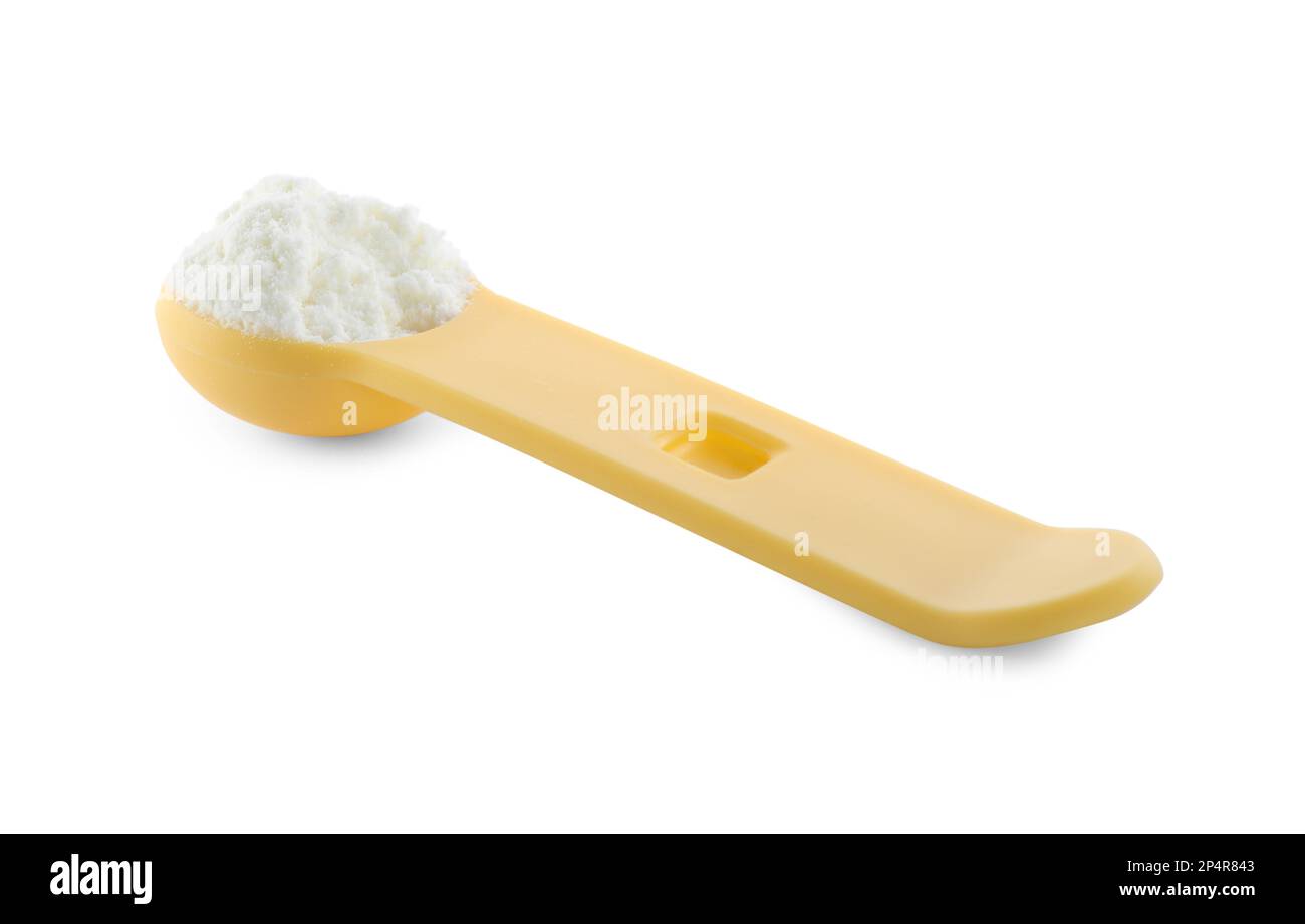 Measuring scoop of powdered infant formula isolated on white. Baby milk ...