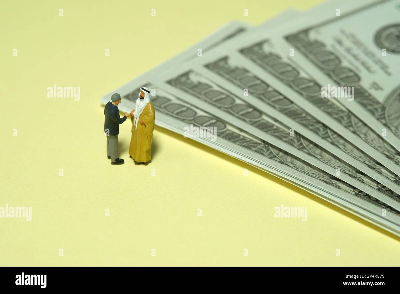 Miniature people toy figure photography. Financial agreement concept. A ...