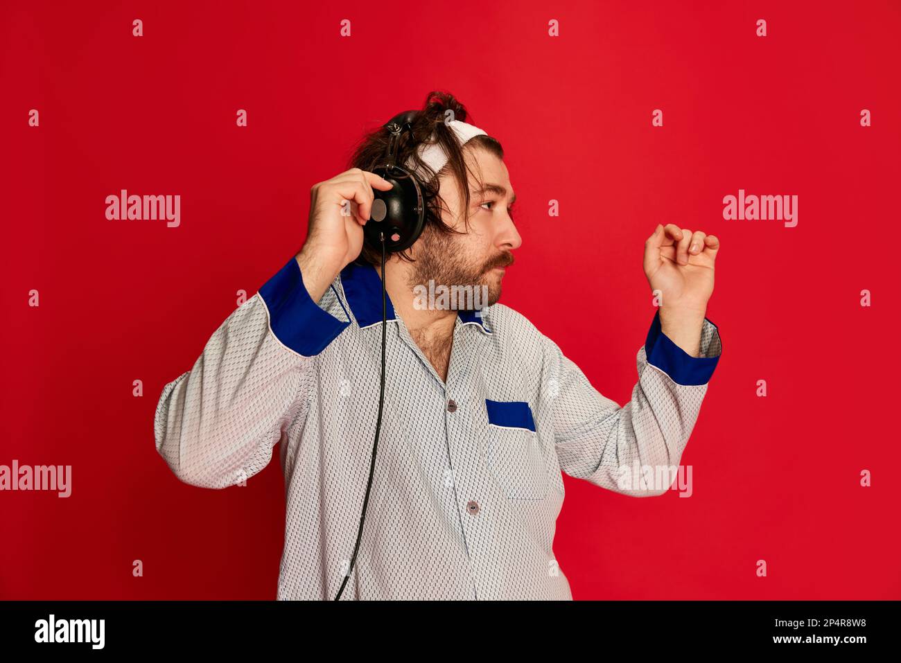 Morning dance. Emotional mature man wearing homewear, pijamas over ...